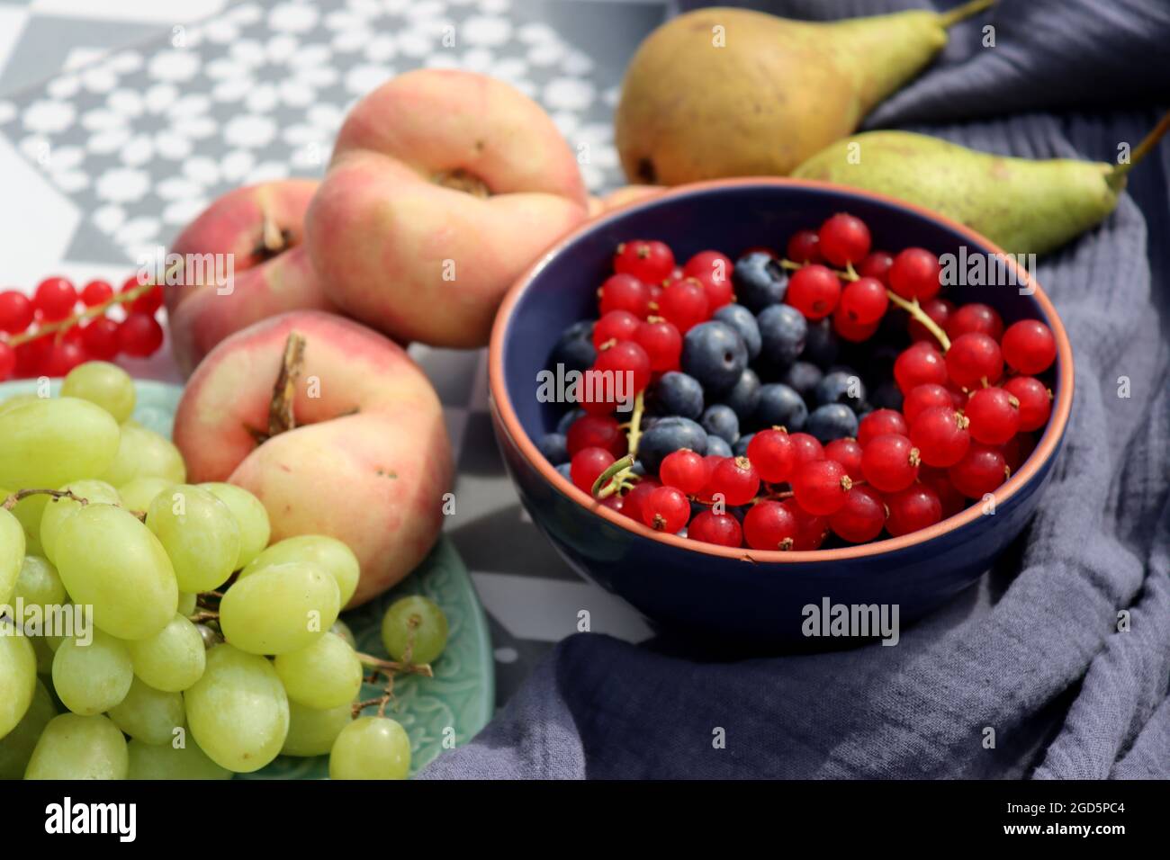 Still life with fruits and berries. Organic berries and fruits on a ...