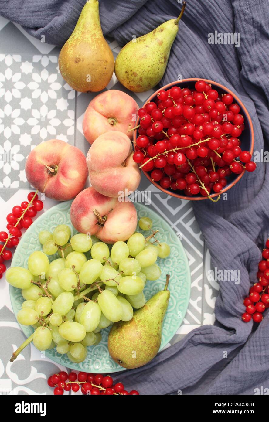 Beautiful summer berries and fruits on a table. Top view photo of ...