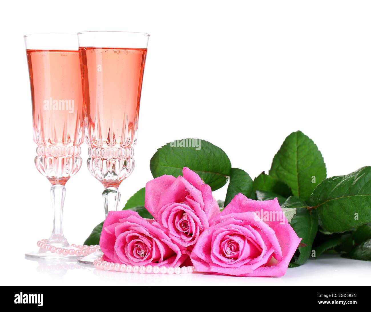 Composition with pink sparkle wine in glasses and pink roses isolated ...