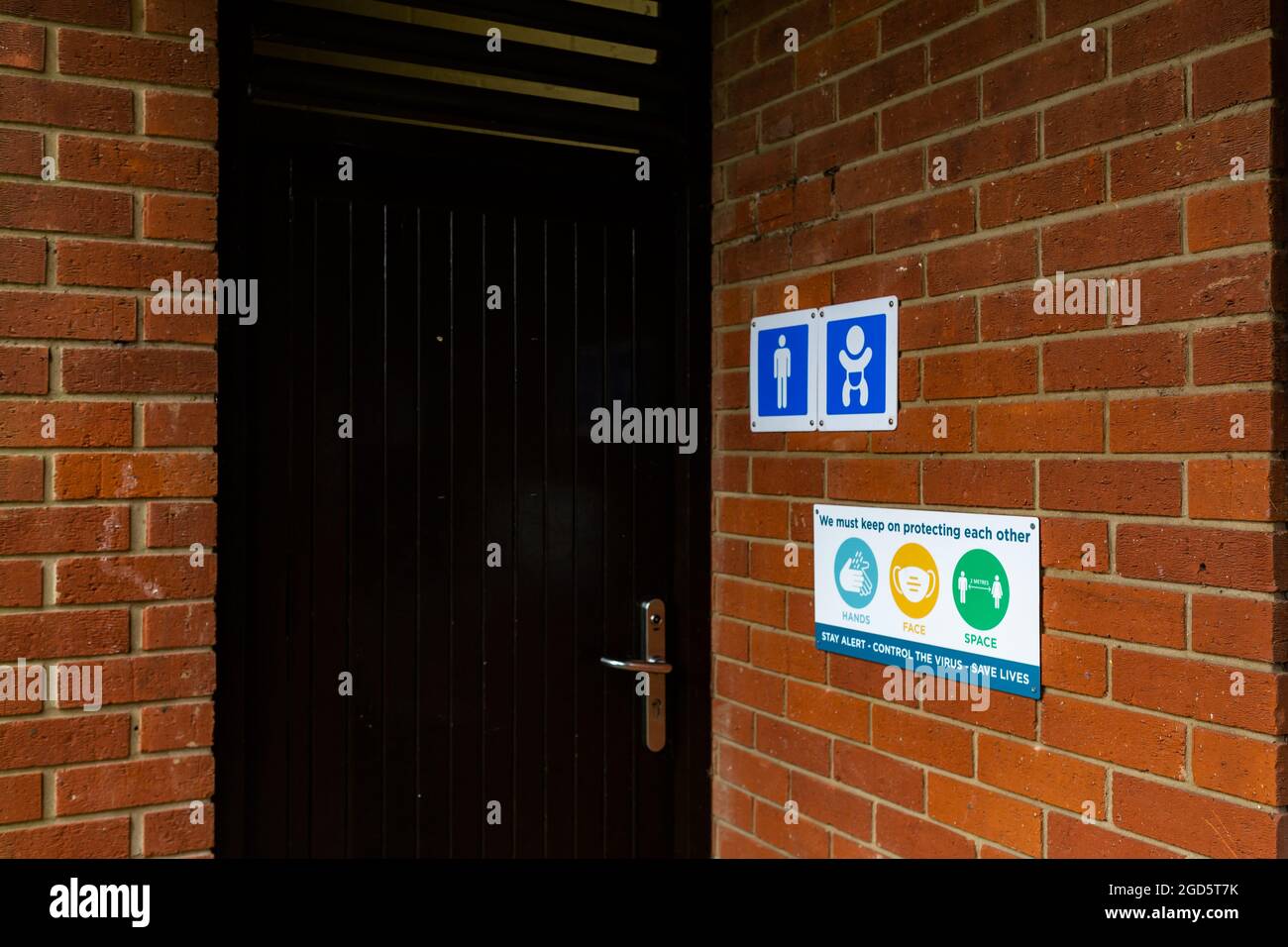 Covid-19 sign outside a public toilet informing the public of the ...