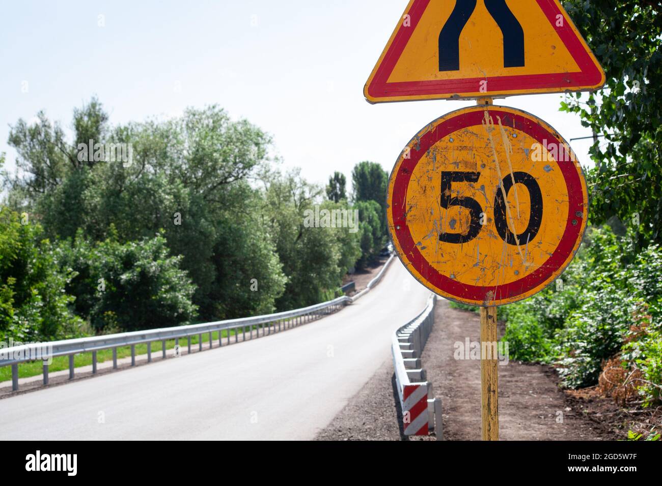 Close-up of old orange peeling sign in very rough condition. Speed ...