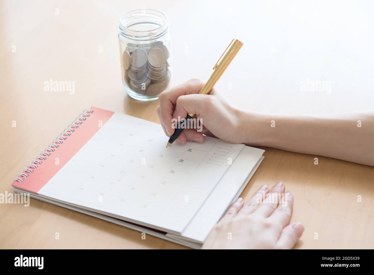 Hand writing in calendar plan concept Stock Photo - Alamy