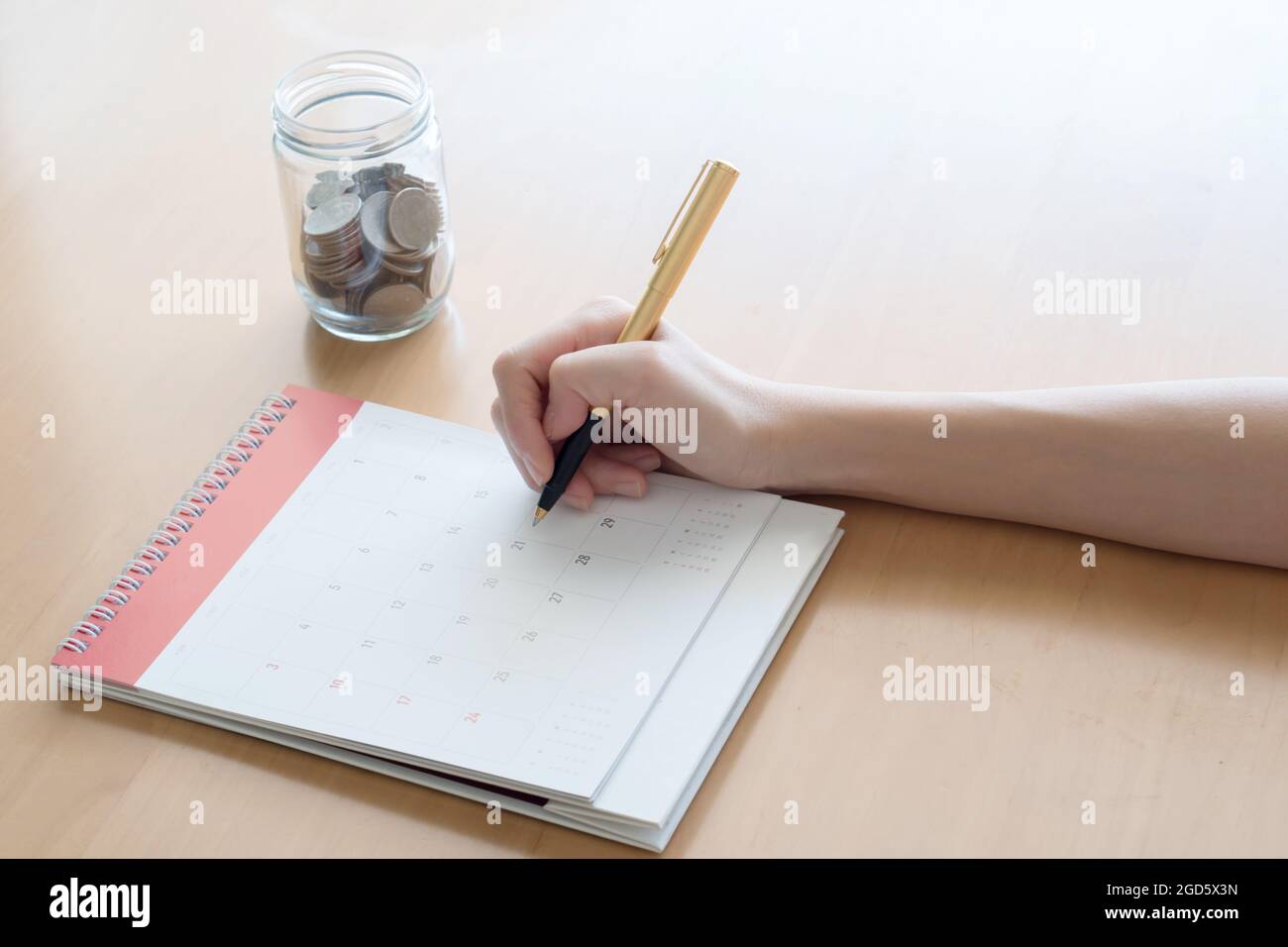 Hand writing in calendar plan concept Stock Photo - Alamy