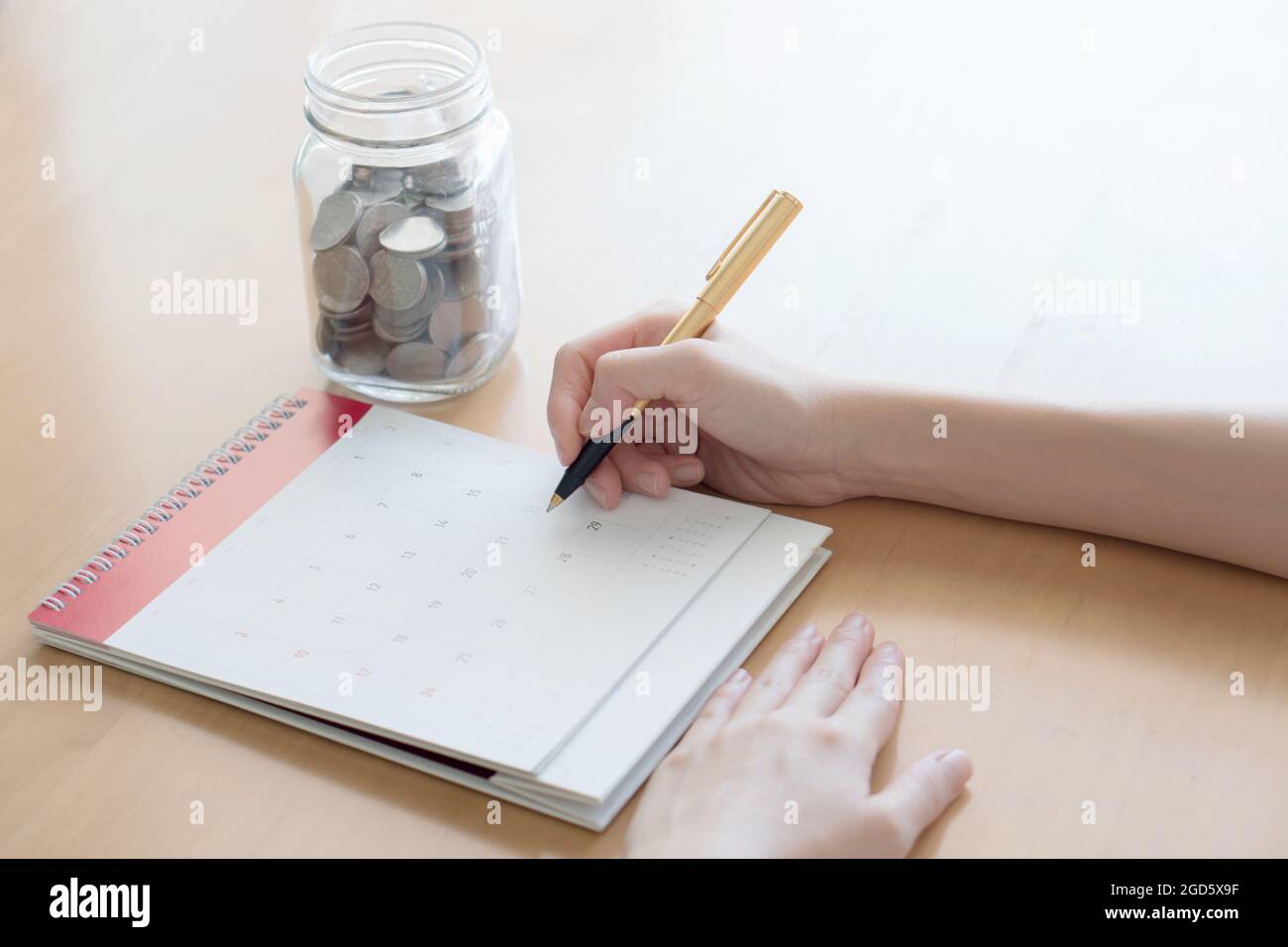 Hand writing in calendar plan concept Stock Photo - Alamy