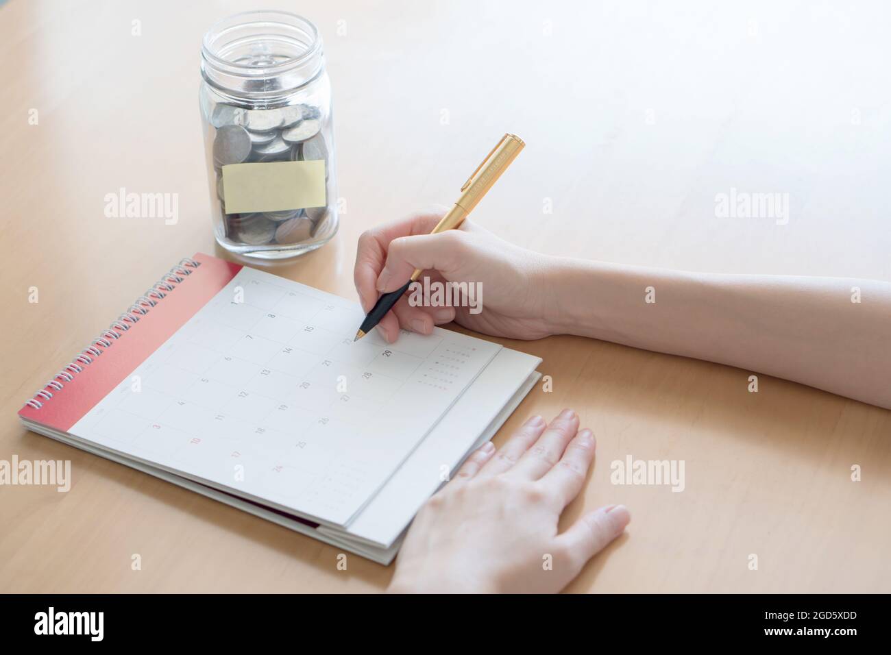 Hand writing in calendar plan concept Stock Photo - Alamy