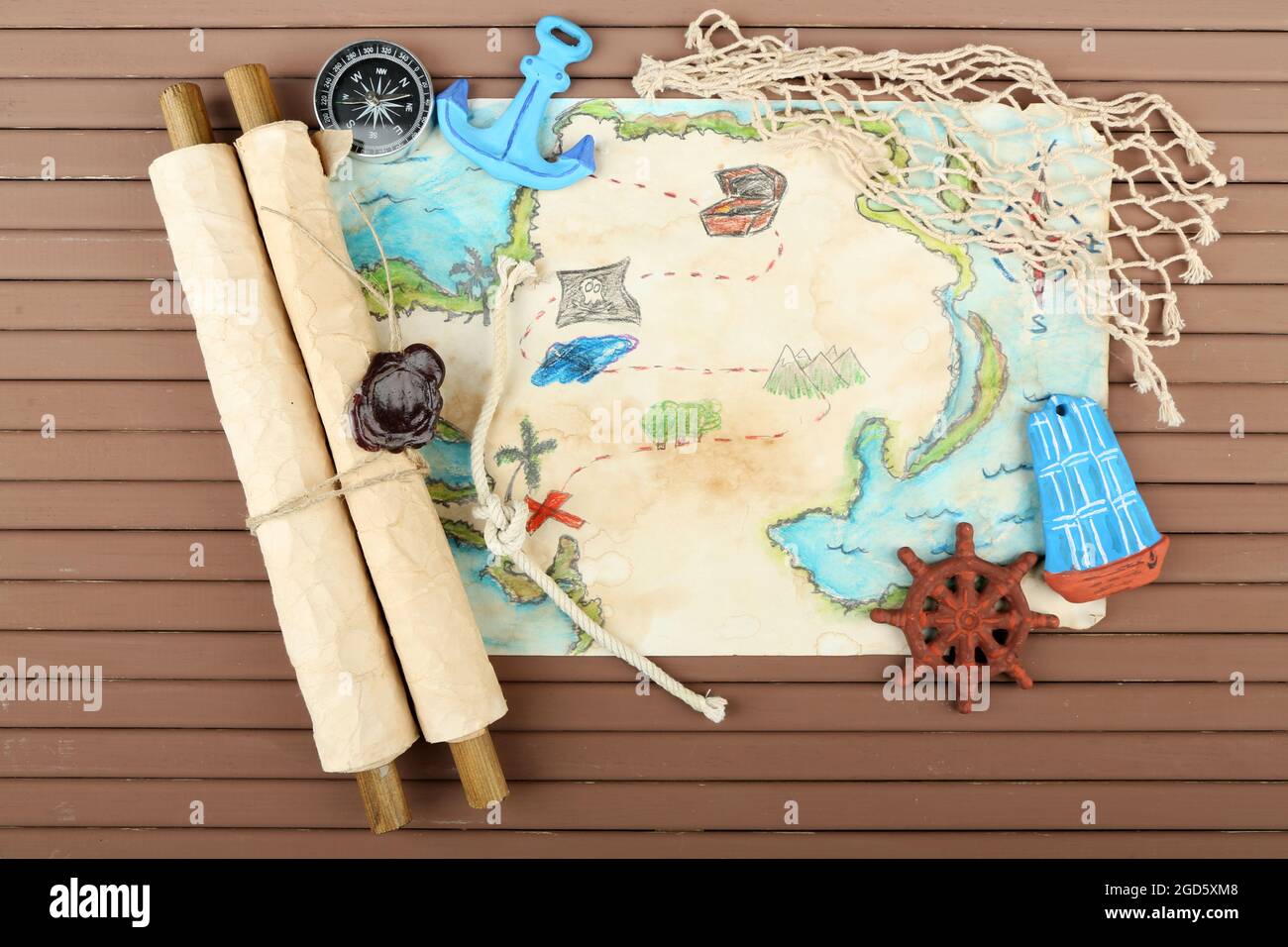 Treasure map with sea accessories, on wooden background Stock Photo - Alamy