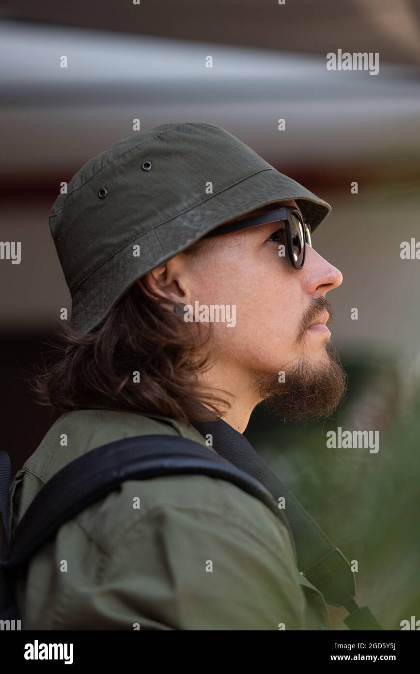 Portrait of young man, photographer, cameraman dreaming during working ...