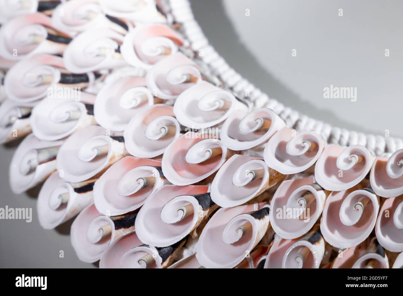 Handmade necklace made of spiral shells, traditional craft product of ...