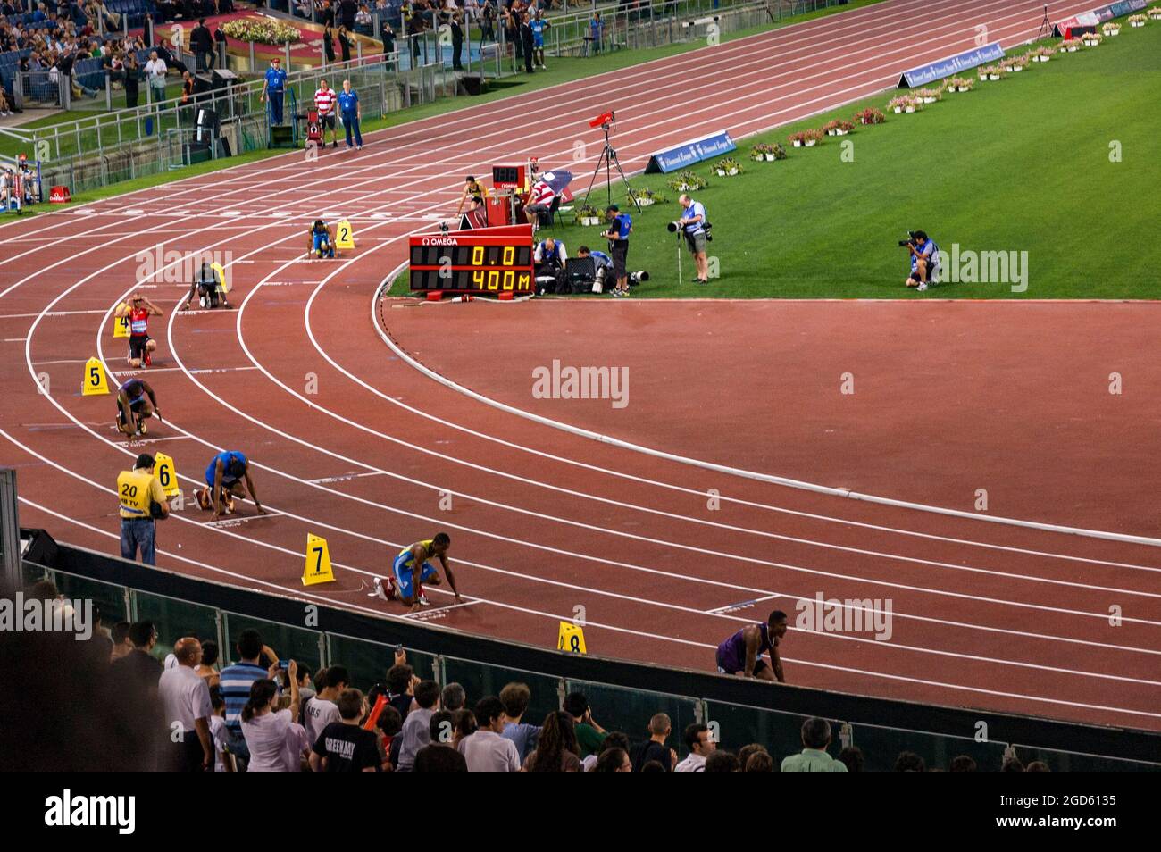 ROME, ITALY - JUNE 10, 2010: Athletes perform 400m run during Rome 2010 ...