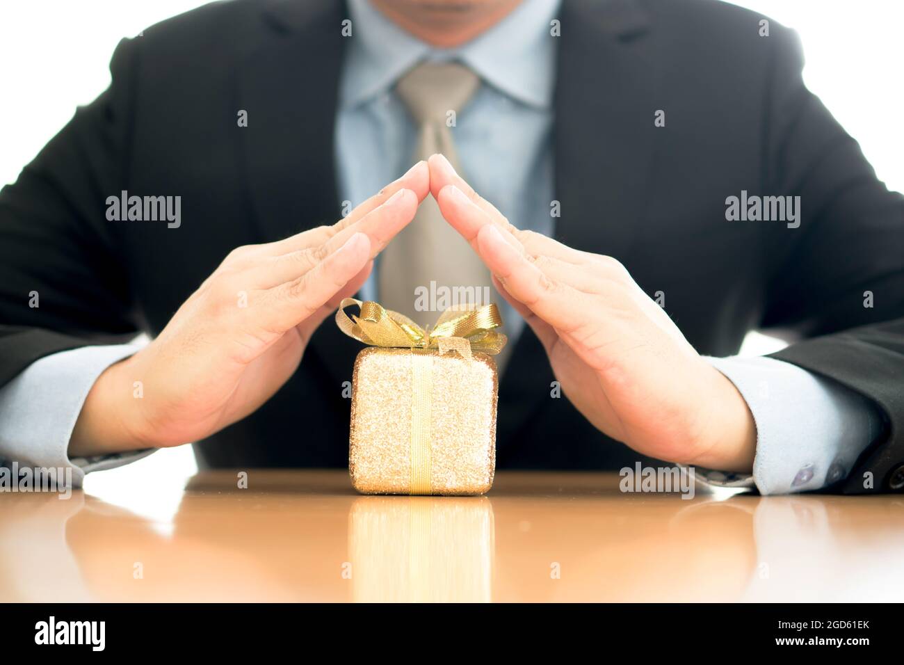 Office man giving gift box hi-res stock photography and images - Alamy
