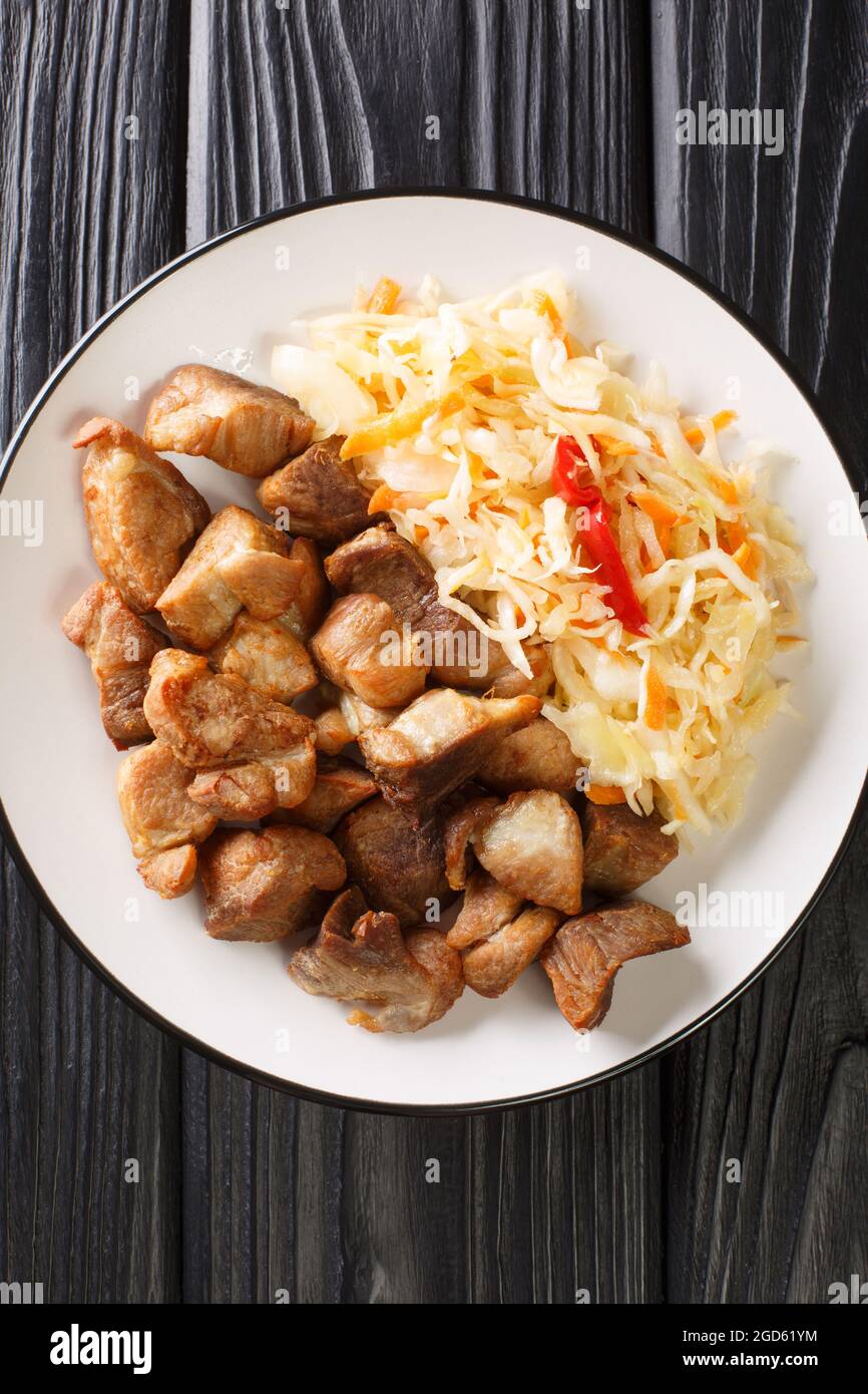 National dish of Haiti Griot or fried pork pieces, marinated in herbs ...