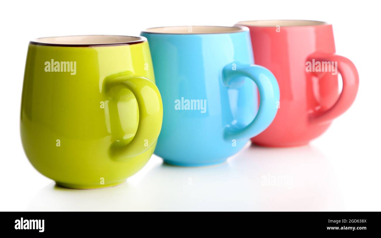 Colorful cups isolated on white Stock Photo - Alamy