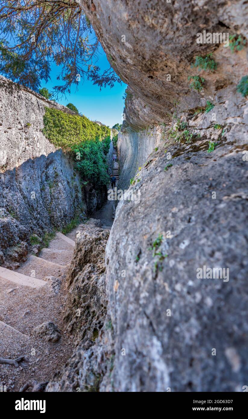 Spectacular steps between the rocks with tourists Stock Photo - Alamy