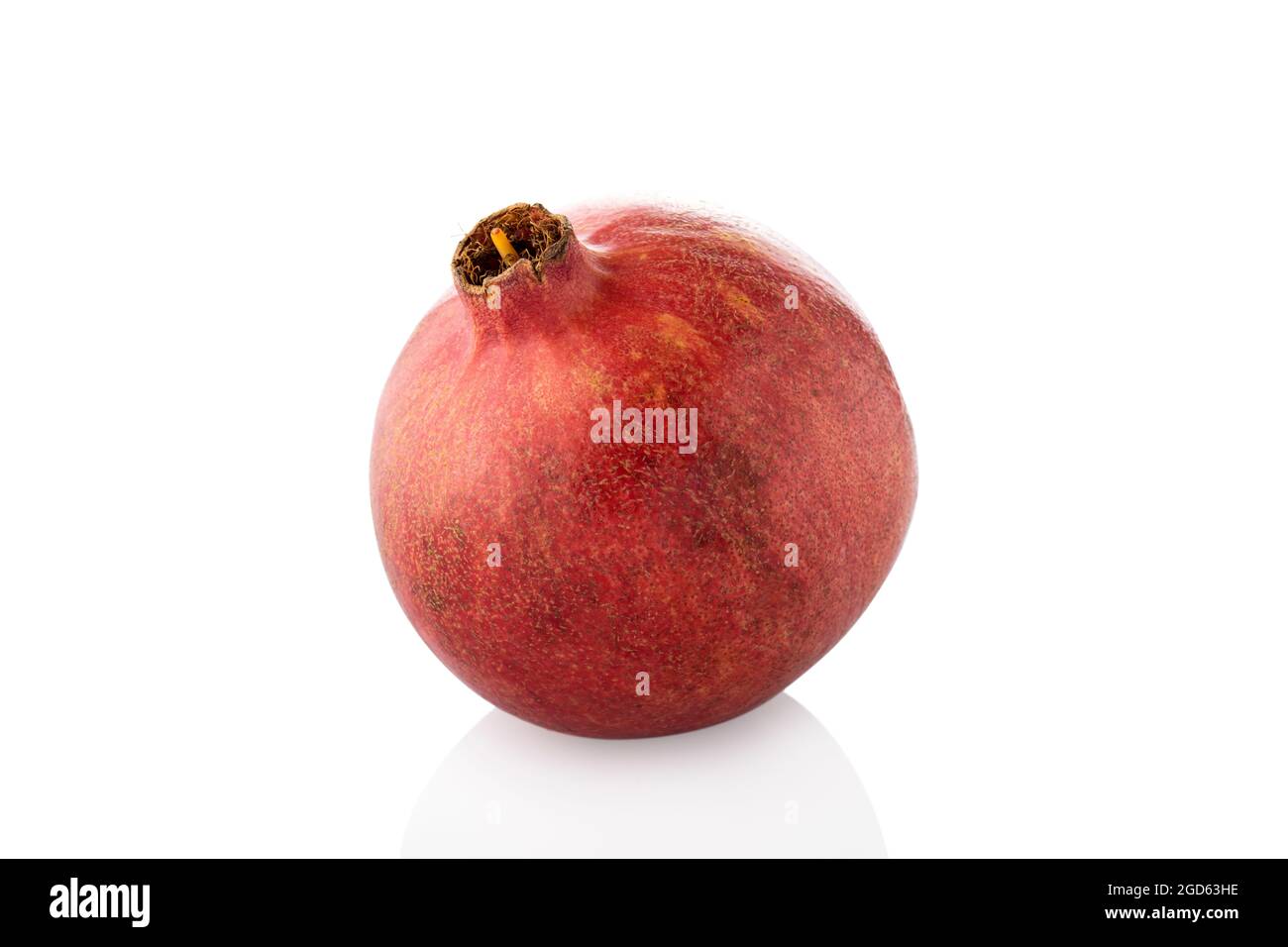 Pomegranate. Single pomegranate on a white background Stock Photo - Alamy