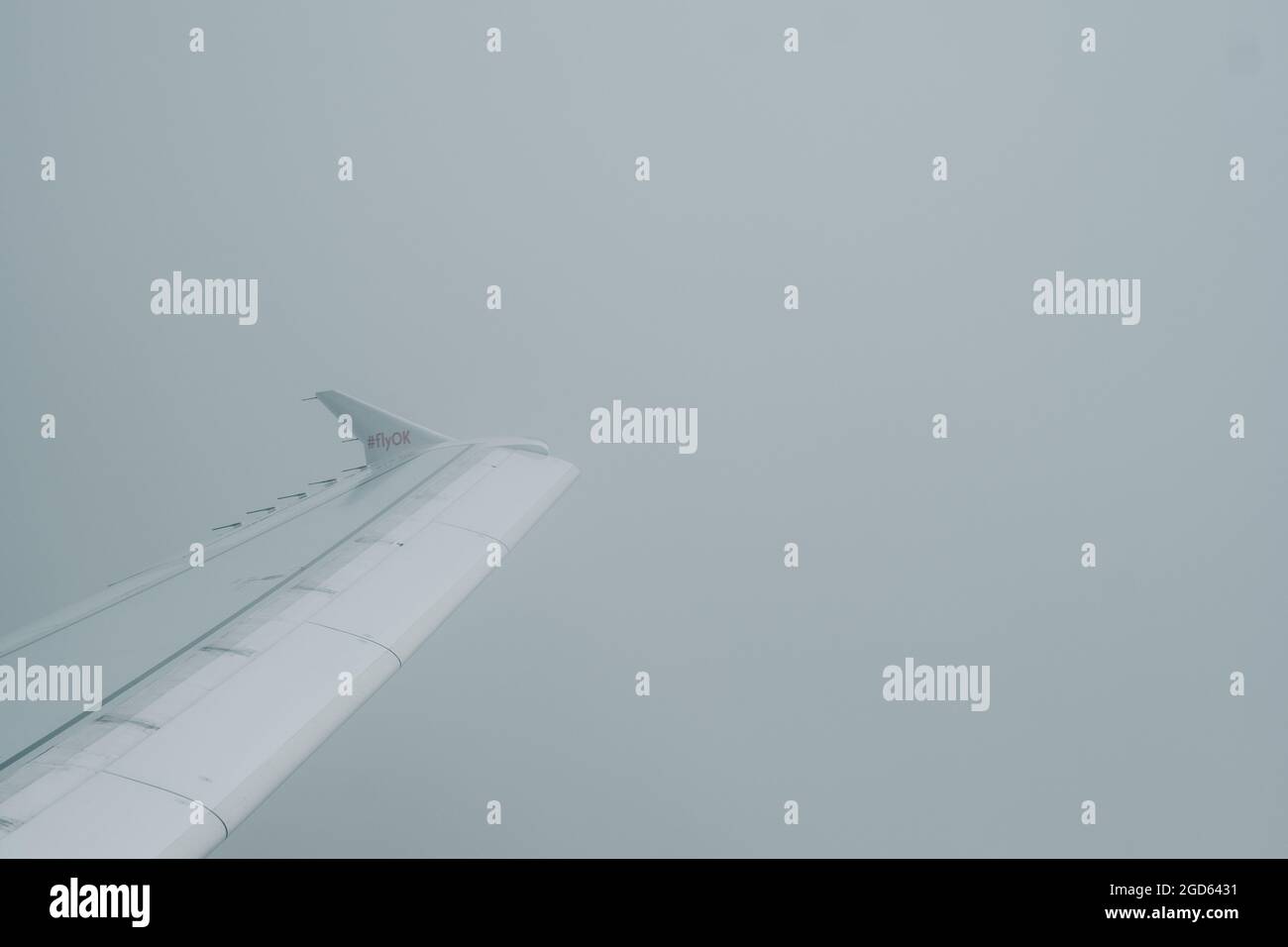 Airplane wing in the fog Stock Photo - Alamy