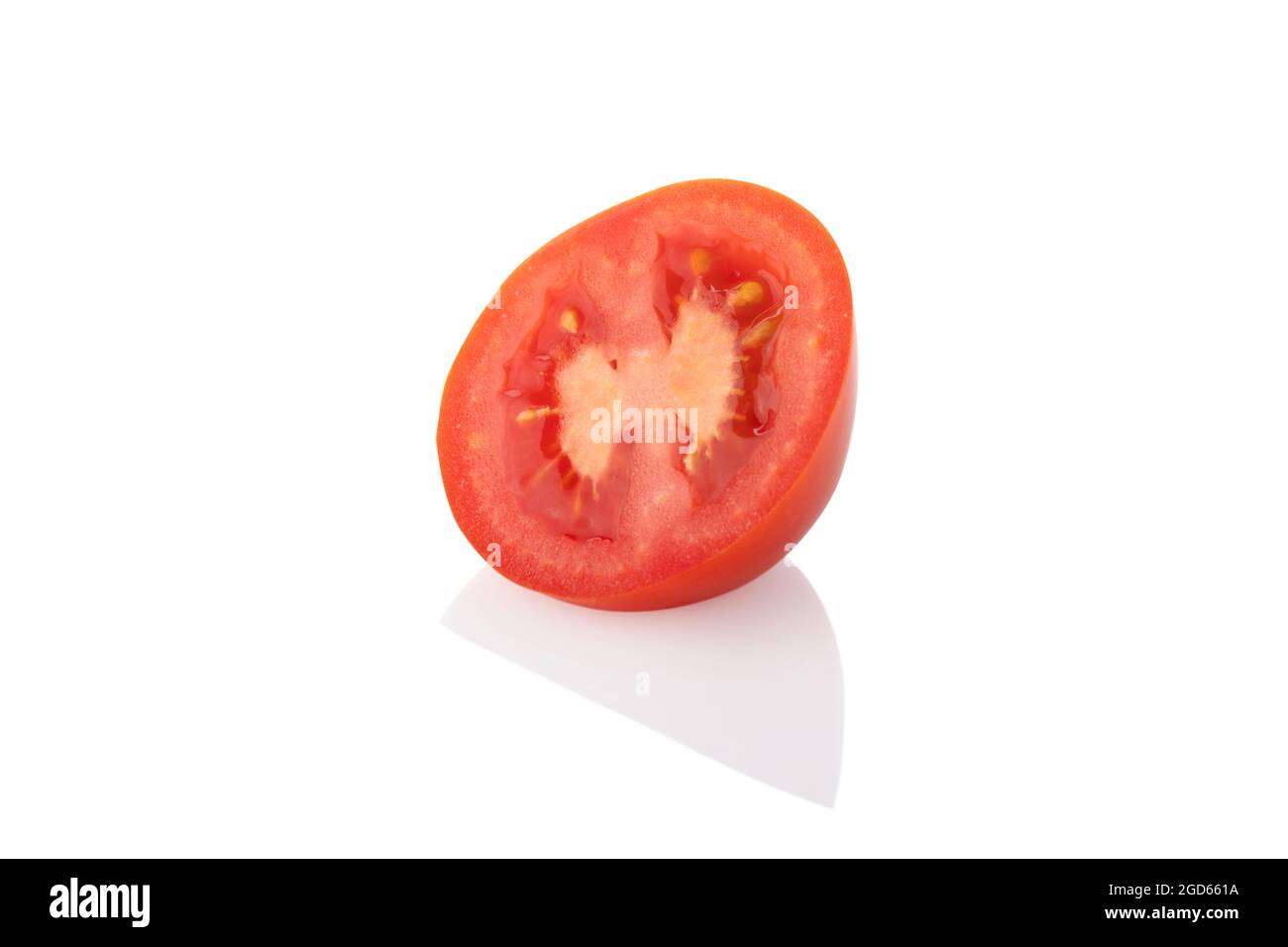 Sliced tomato - Single half tomato facing left on a white background ...