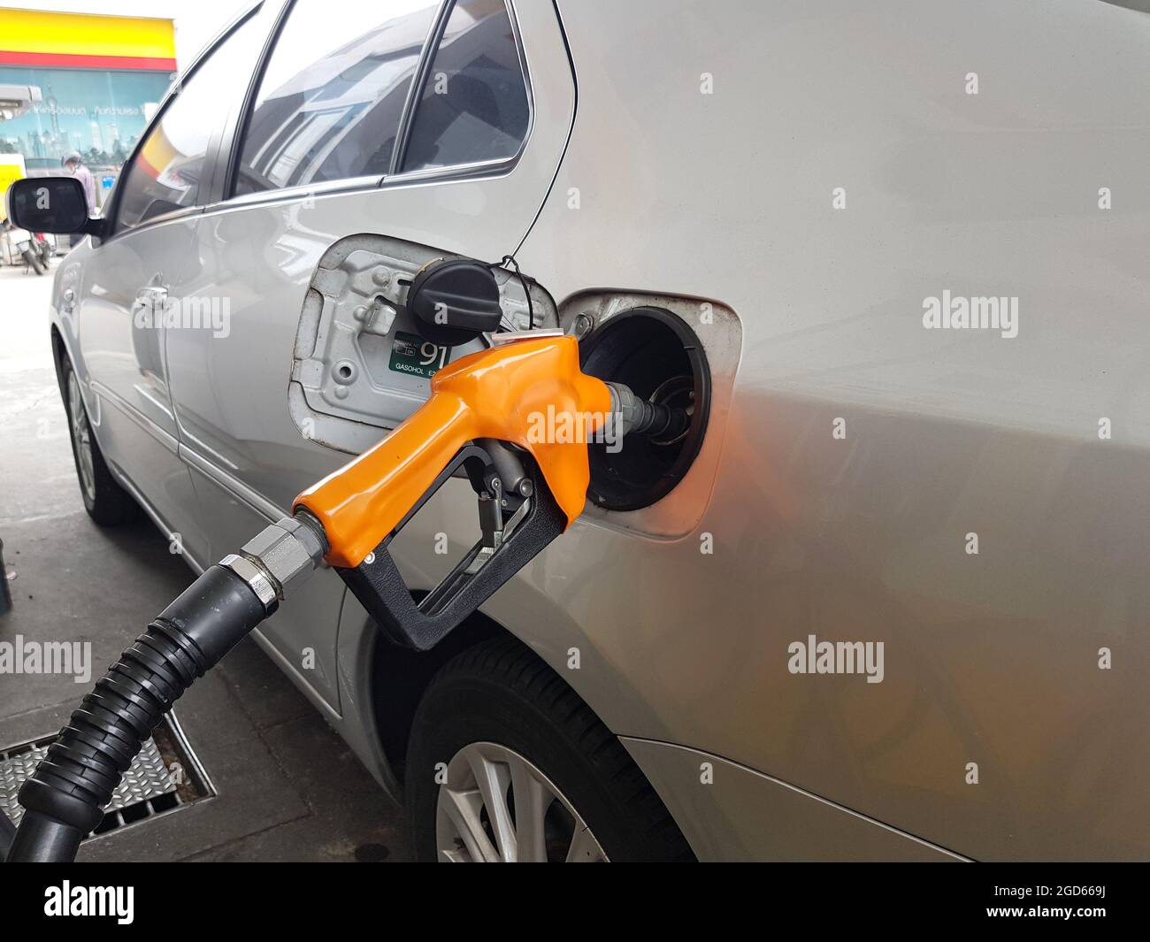 Pumping Gas Into Gas Stock Photo - Alamy