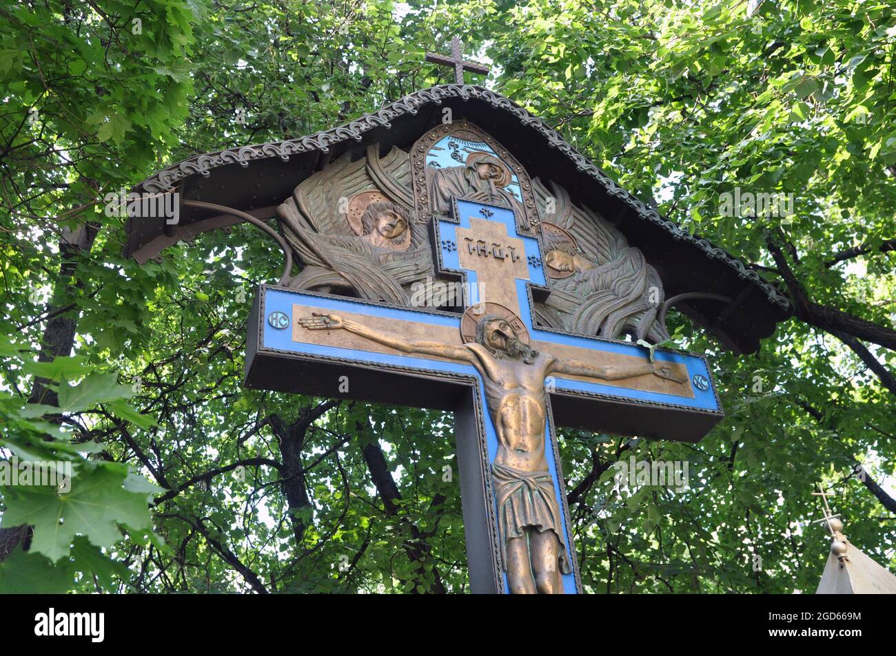 Orthodox cross on a background of green populations. Moscow, Russia ...