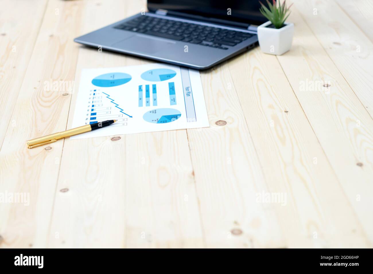 Office workplace with pc, charts Stock Photo - Alamy