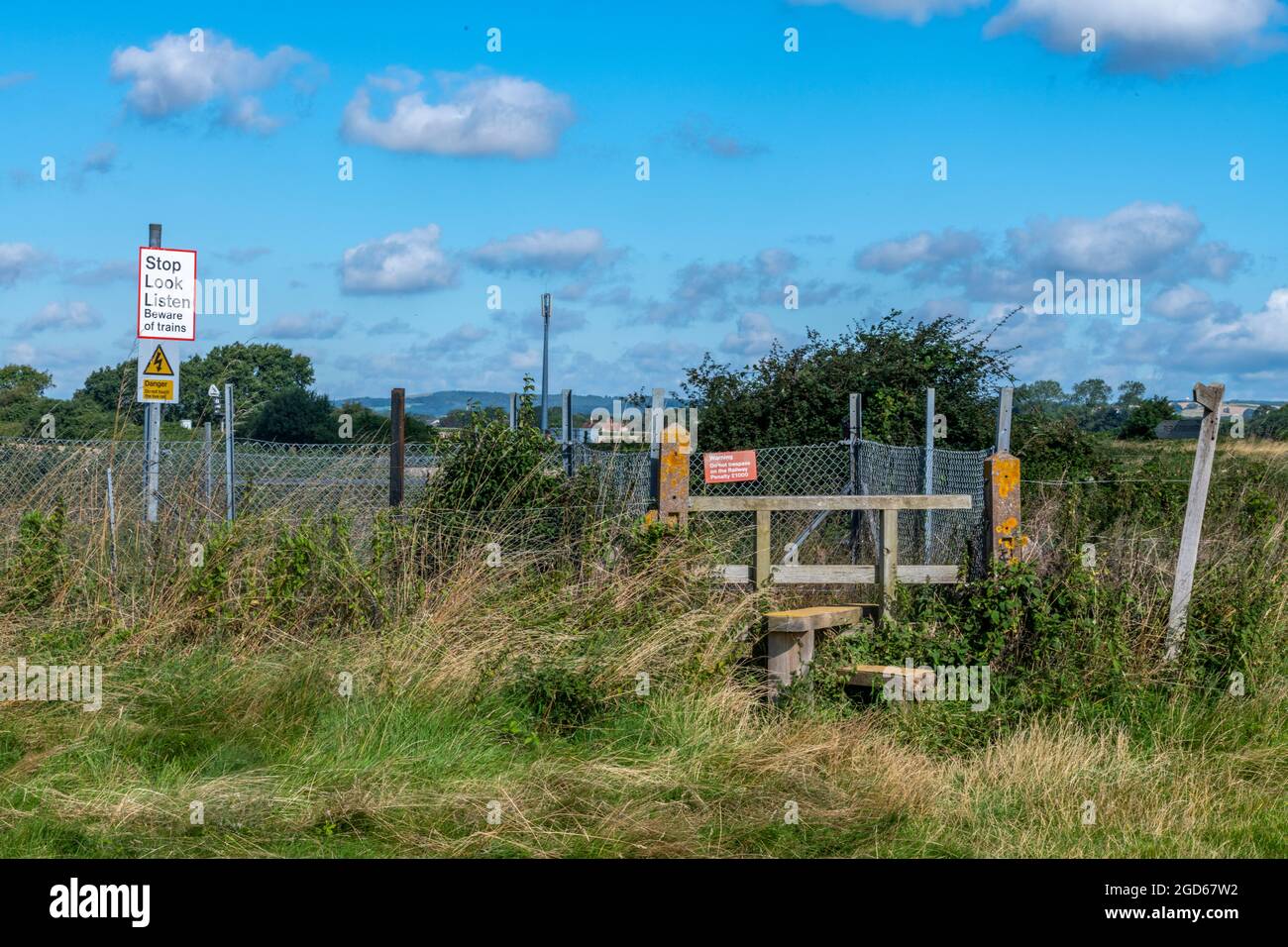 a railway footpath crossing, stiles at a rail crossing, railway remote ...