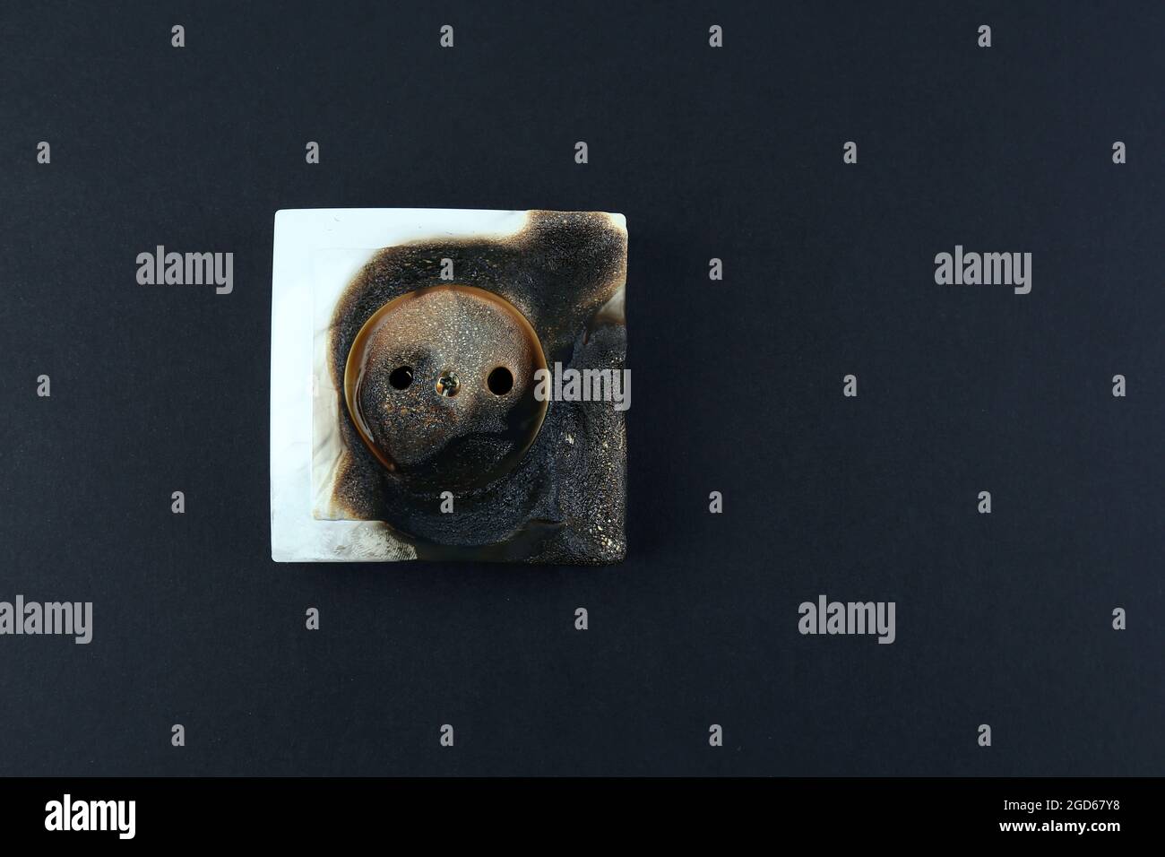 Burned plug socket close up Stock Photo - Alamy