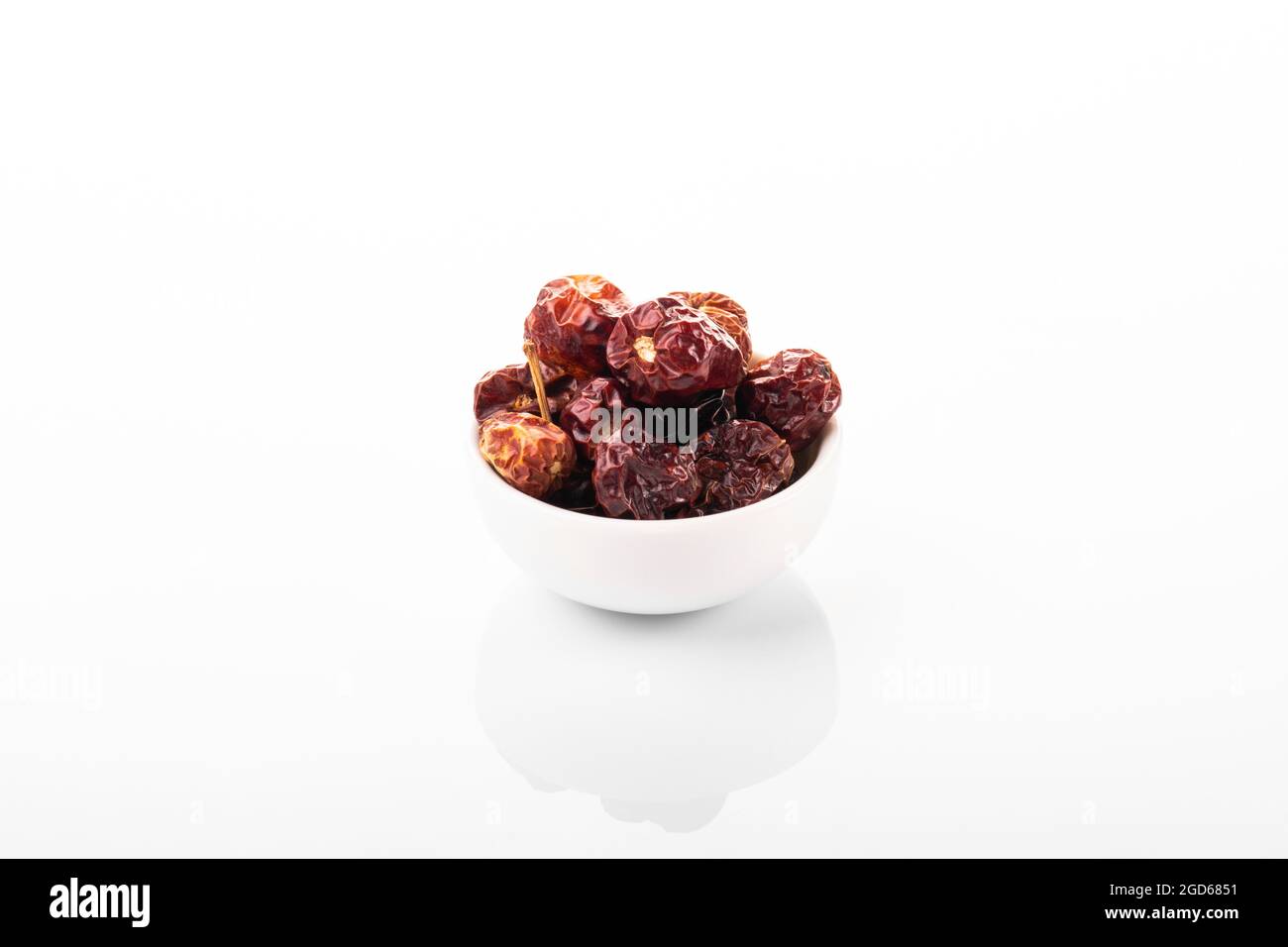 Dry red chili pepper. Dry red chili pepper in white bowl, on white ...