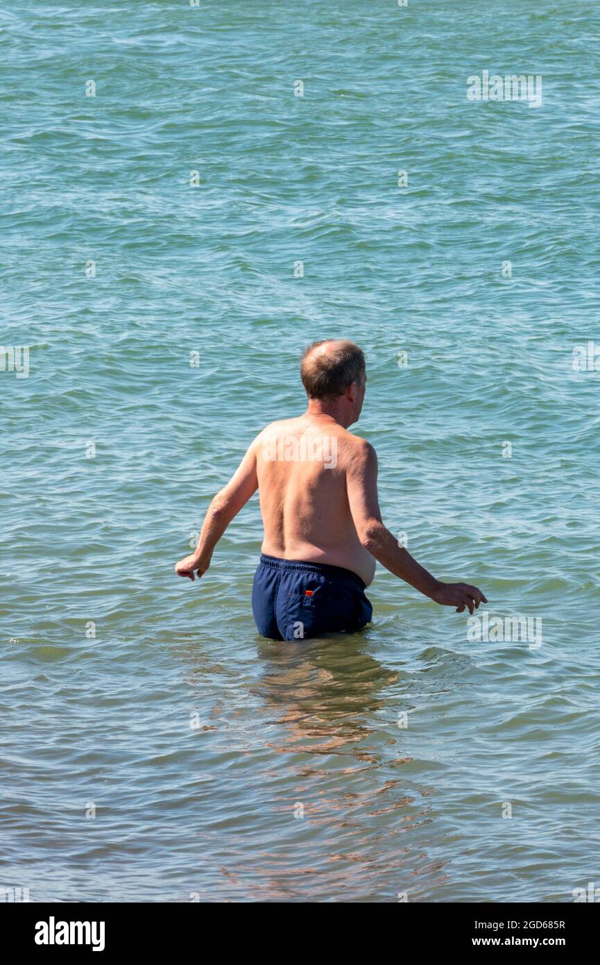 middle-aged man sea swimming, older man wild swimming, wild swimmer ...