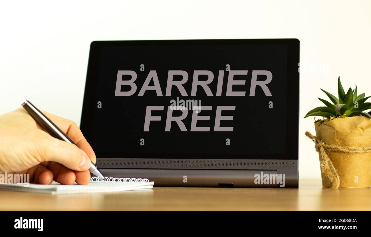 Barrier free symbol. Tablet with words 'barrier free'. Businessman hand ...