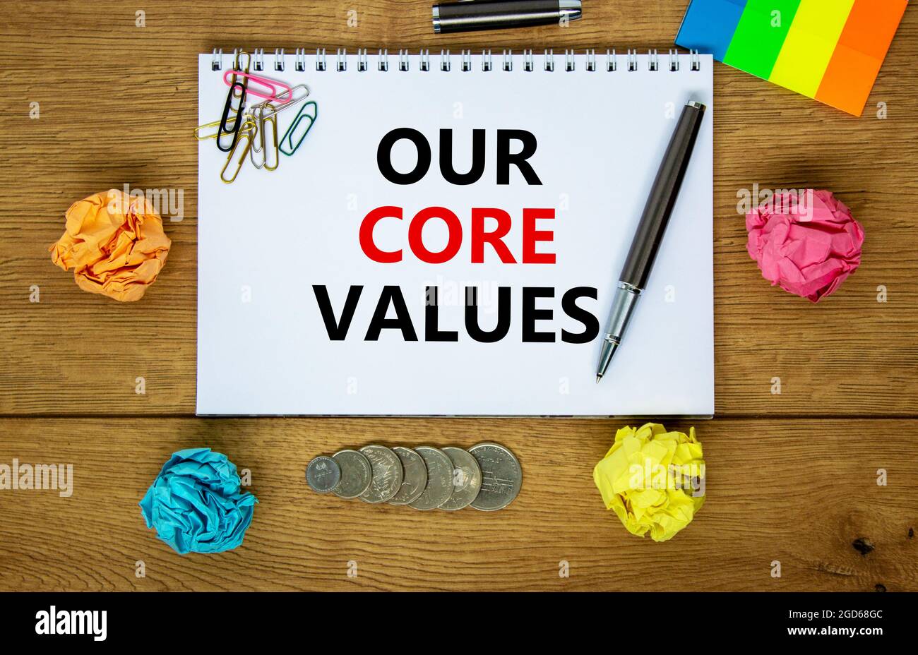 Our core values symbol. Words 'Our core values' on white note. Wooden ...