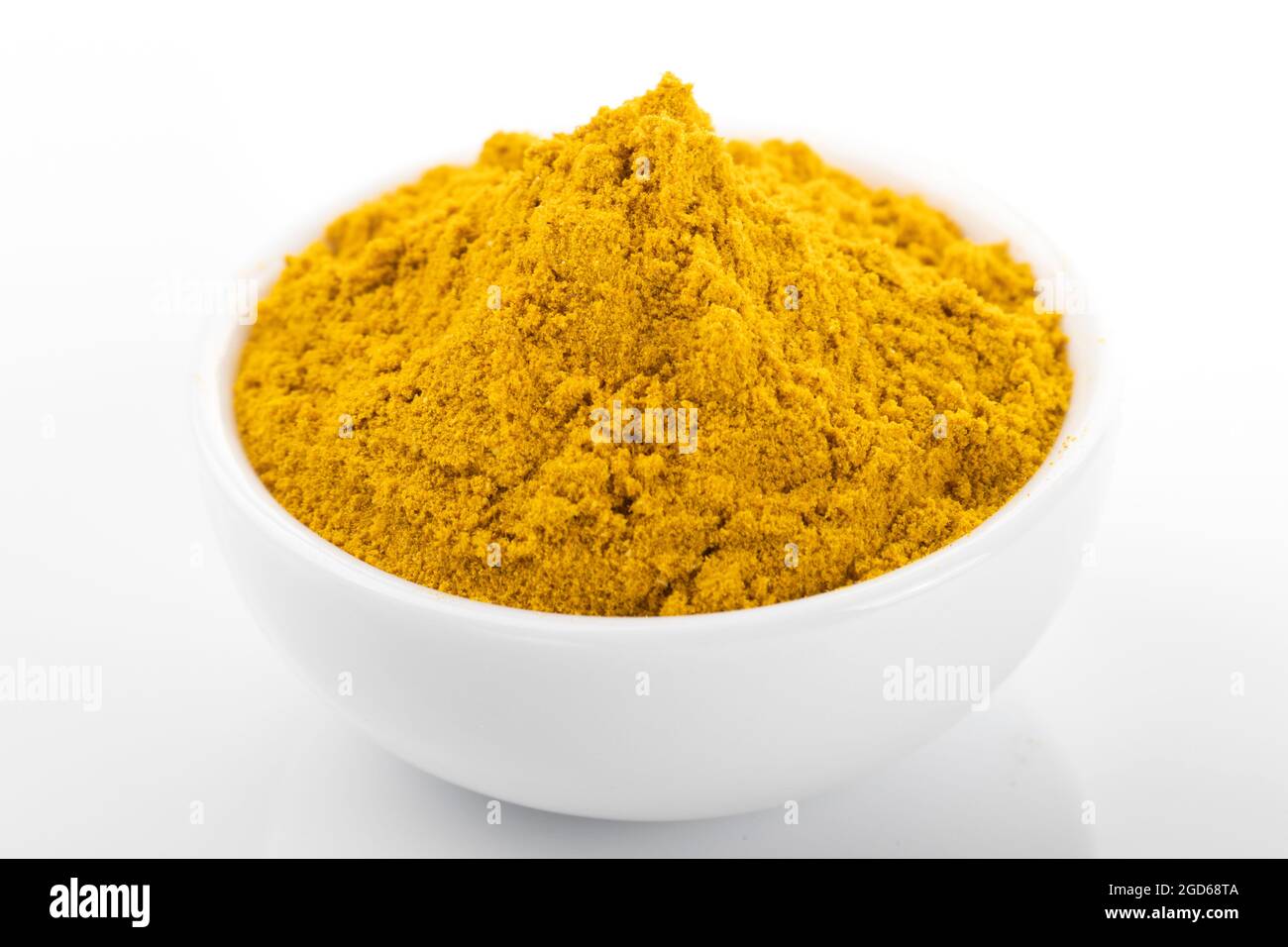 Curry powder. Curry powder in white bowl, on white background. Curry ...