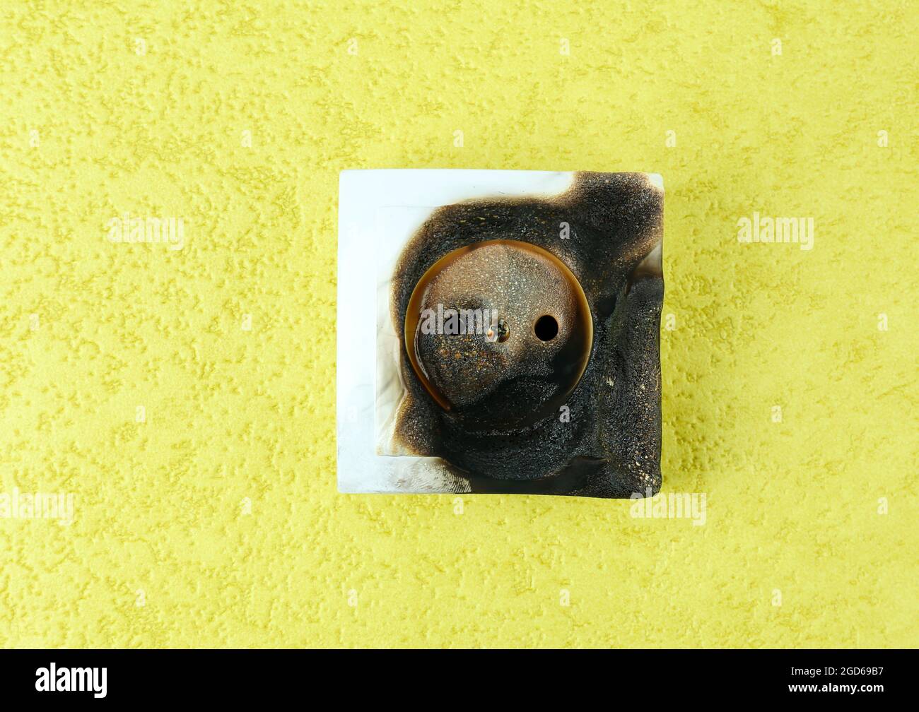Burned plug socket close up Stock Photo - Alamy