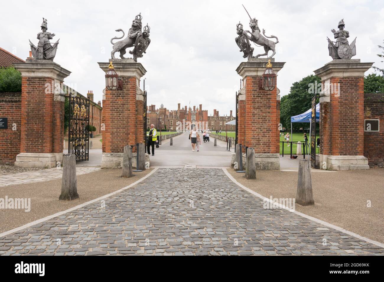 The entrance gates to the historic Hampton Court Palace, Surrey ...