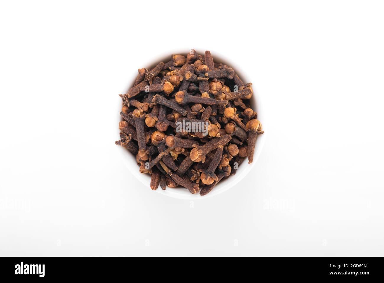 Clove, clove seed. Macro shot, Clove seed in white bowl, on white ...