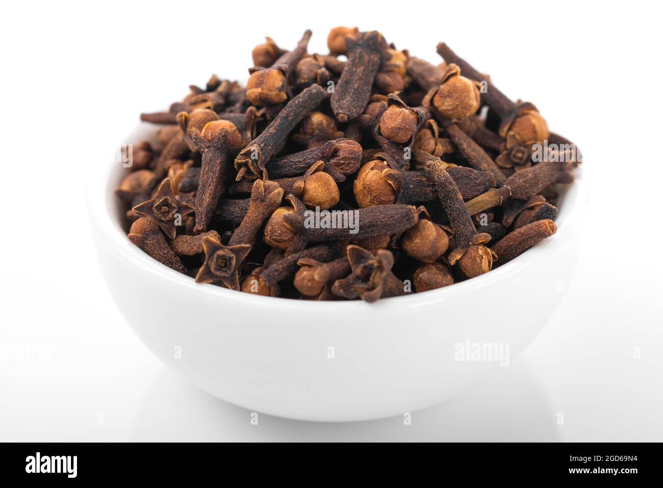 Clove, clove seed. Macro shot, Clove seed in white bowl, on white ...