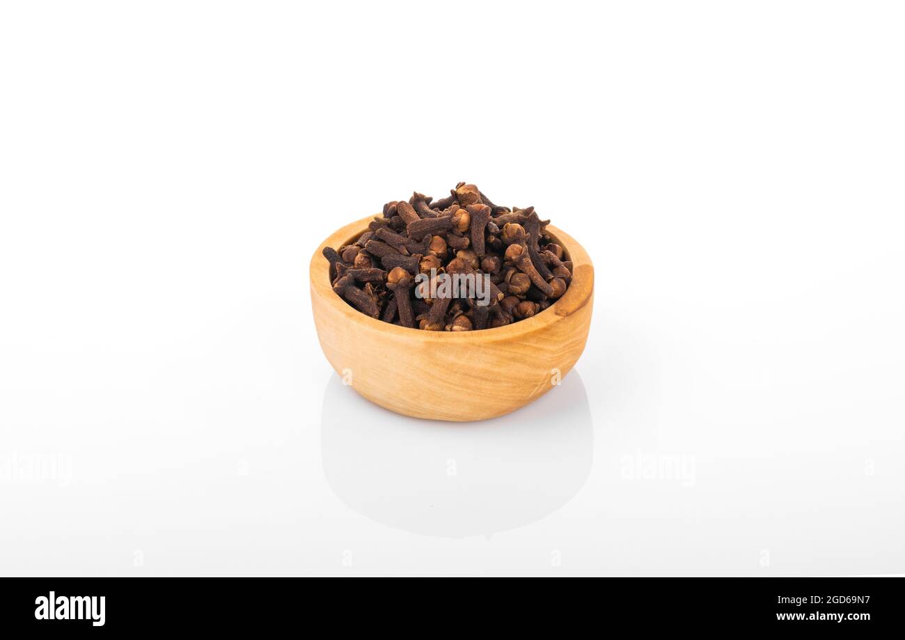 Clove, clove seed. Macro shot, Clove seed in wooden bowl, on white ...