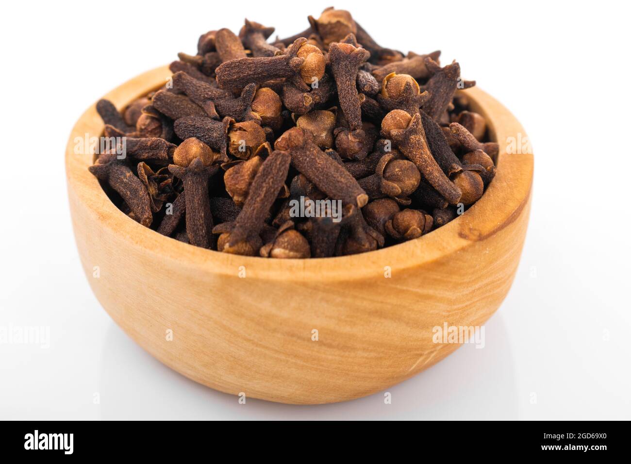 Clove, clove seed. Macro shot, Clove seed in wooden bowl, on white ...