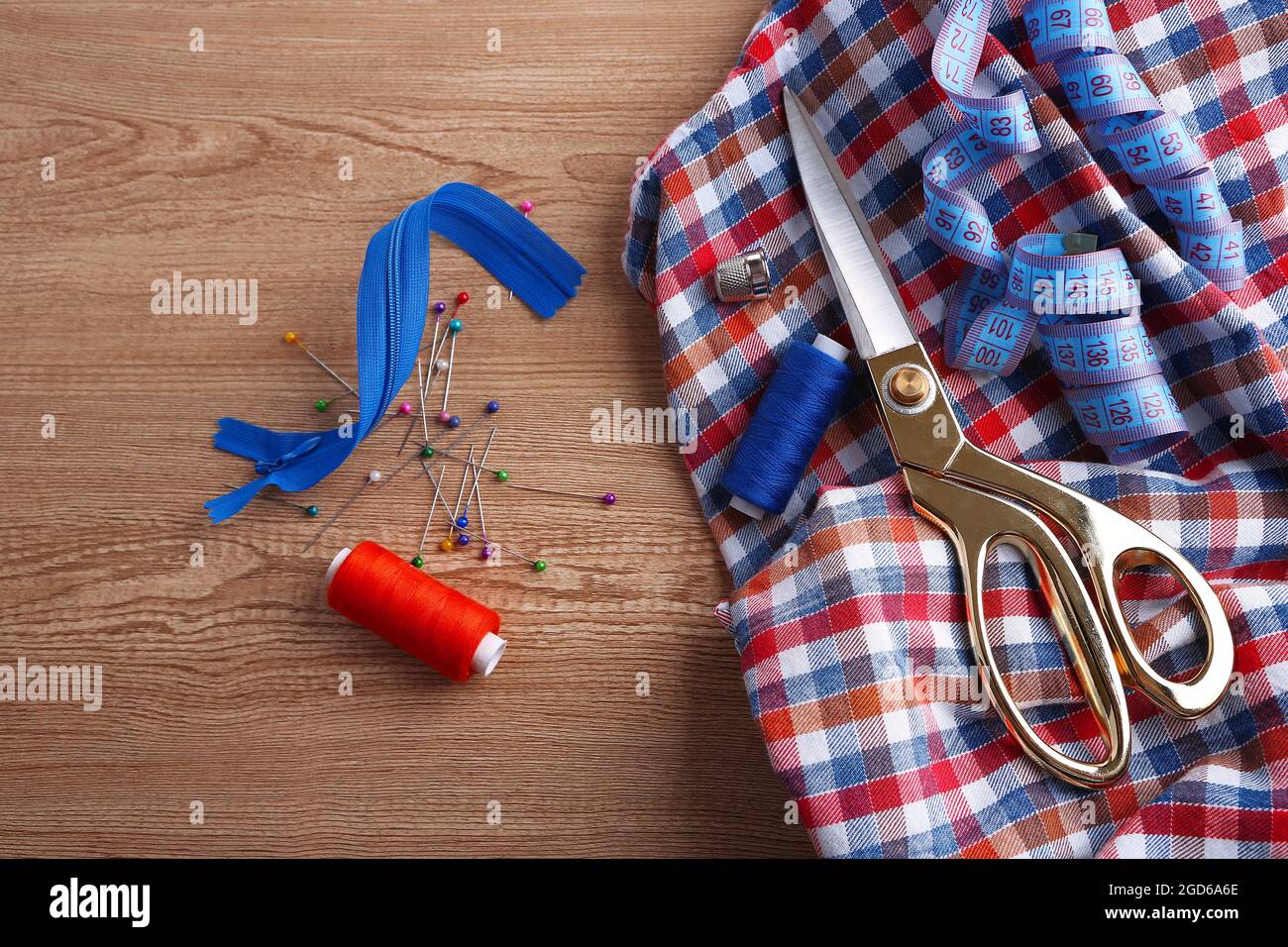 Business suit tailoring, on wooden background Stock Photo - Alamy