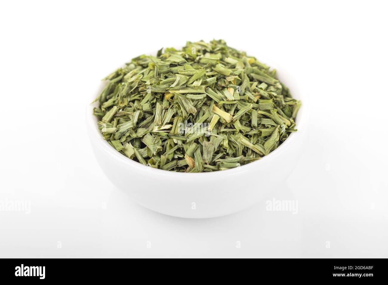 dry chopped spring onion in white bowl on white background. dry chopped ...