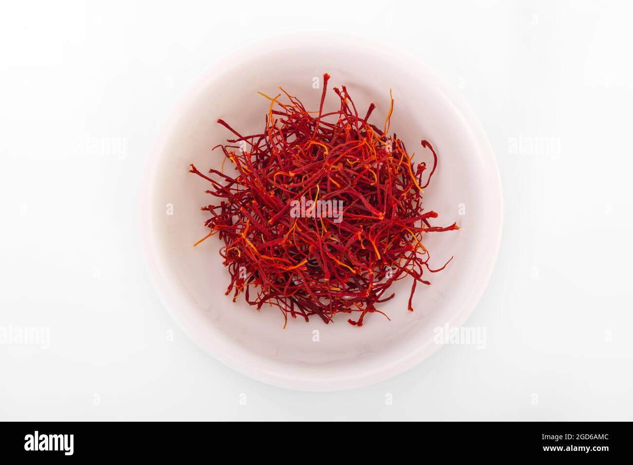 saffron. dried saffron in white bowl on white background. saffron spice ...