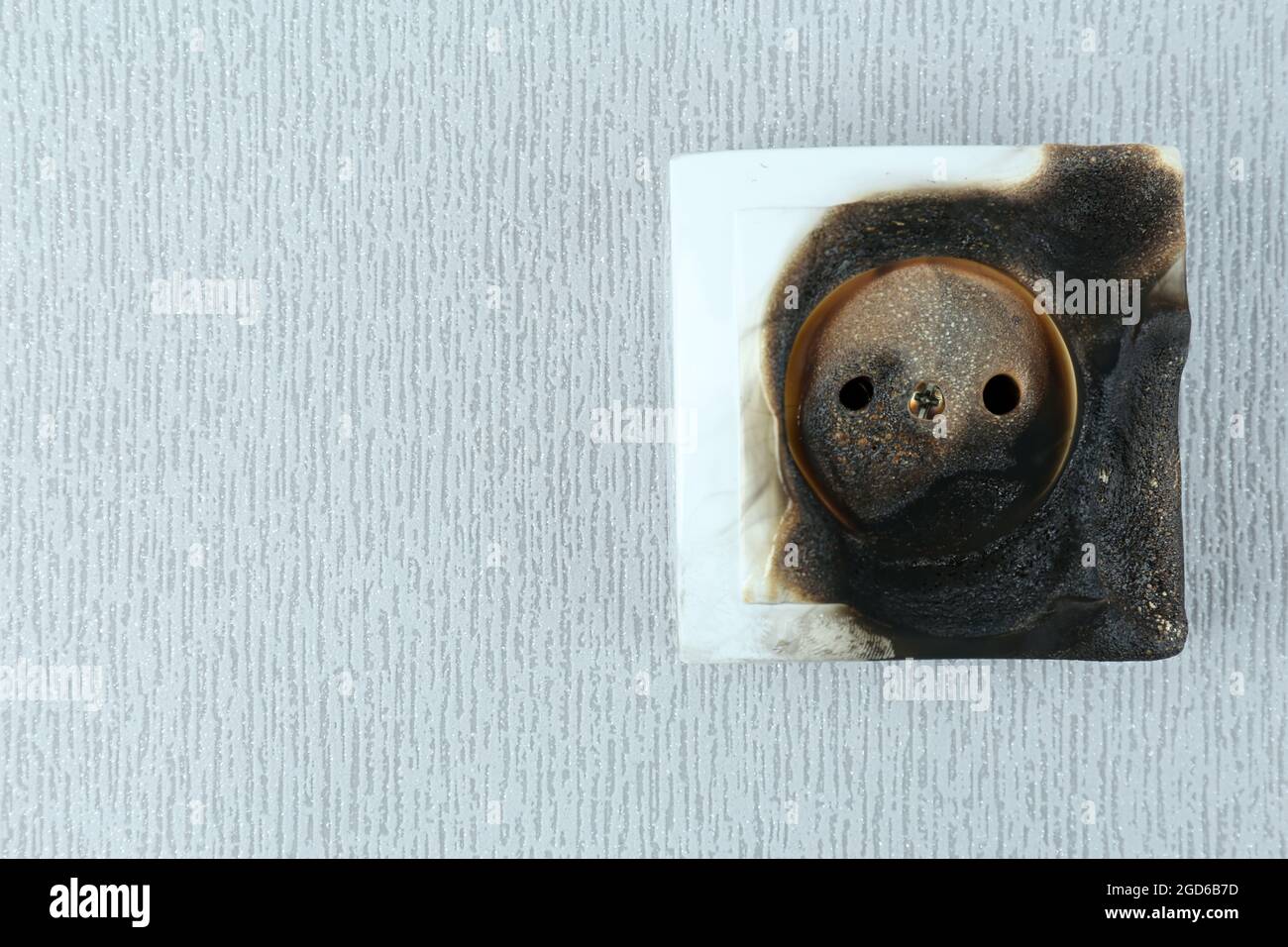 Burned plug socket close up Stock Photo - Alamy