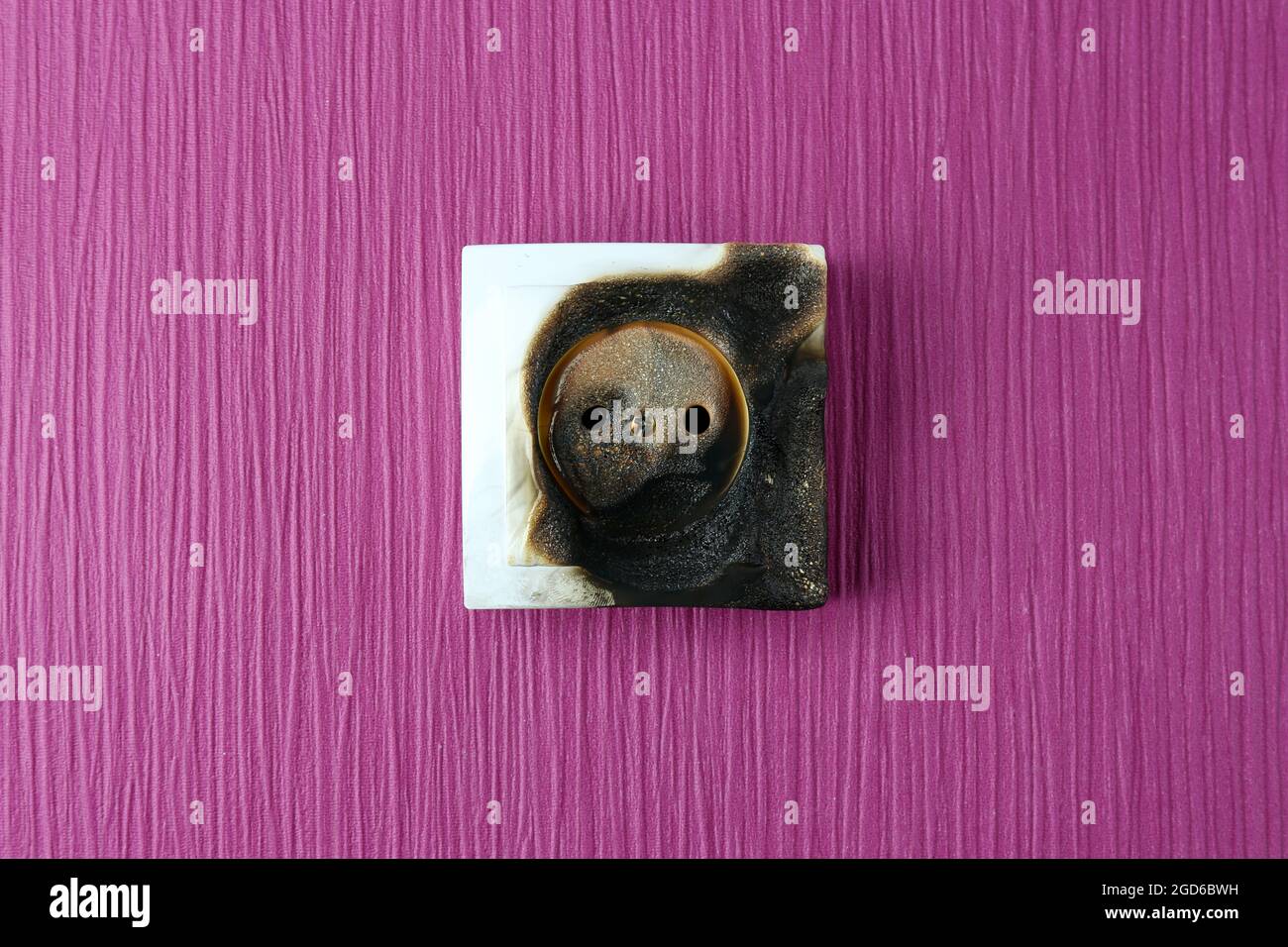 Burned plug socket close up Stock Photo - Alamy