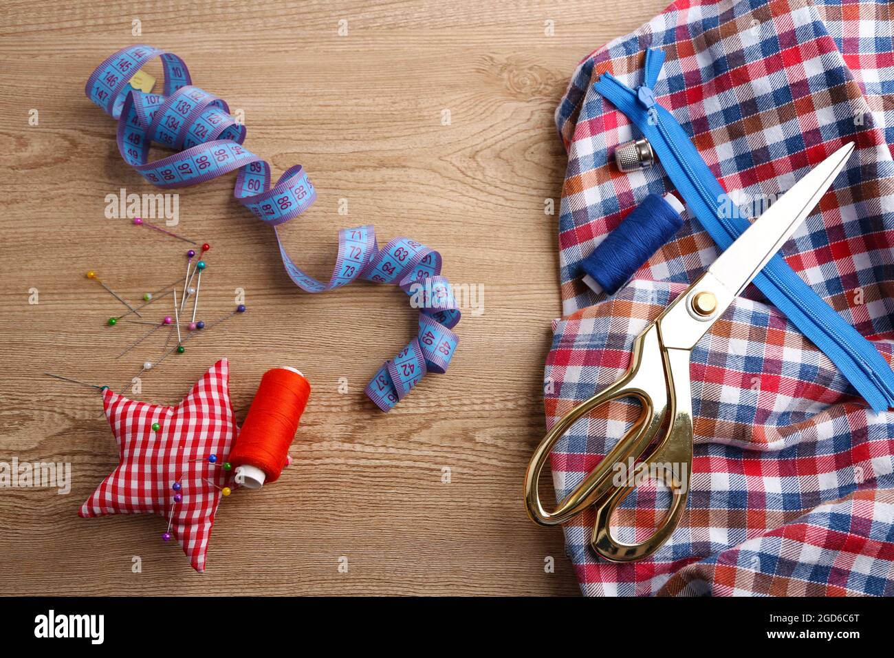 Business suit tailoring, on wooden background Stock Photo - Alamy