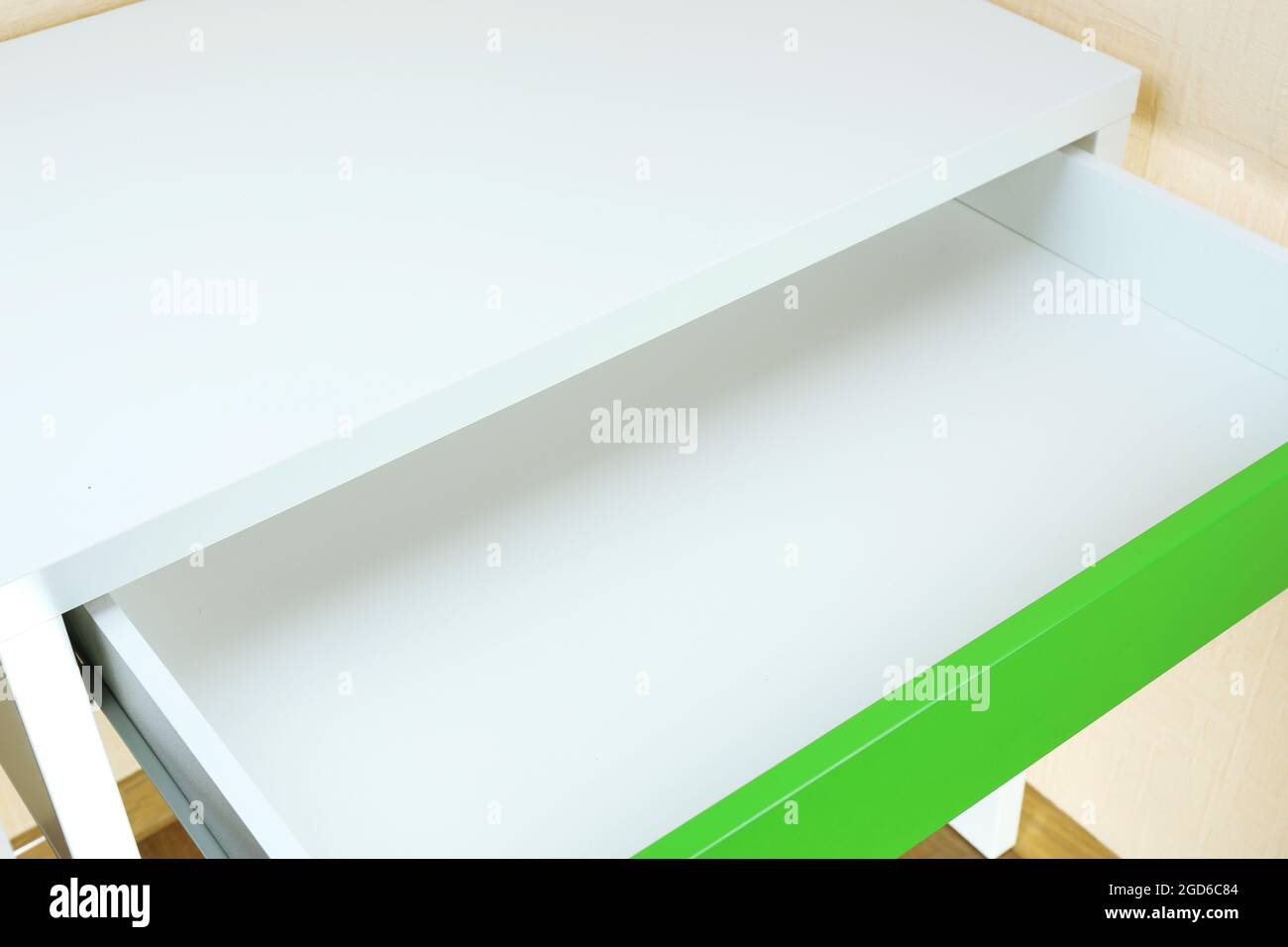 Table with opened empty drawer Stock Photo - Alamy