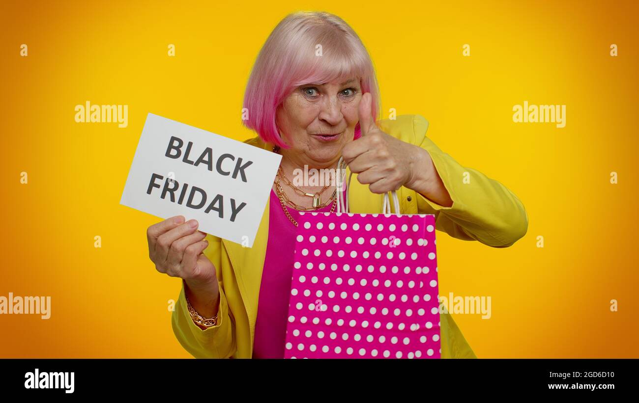 Elderly granny woman showing Black Friday inscription banner text ...