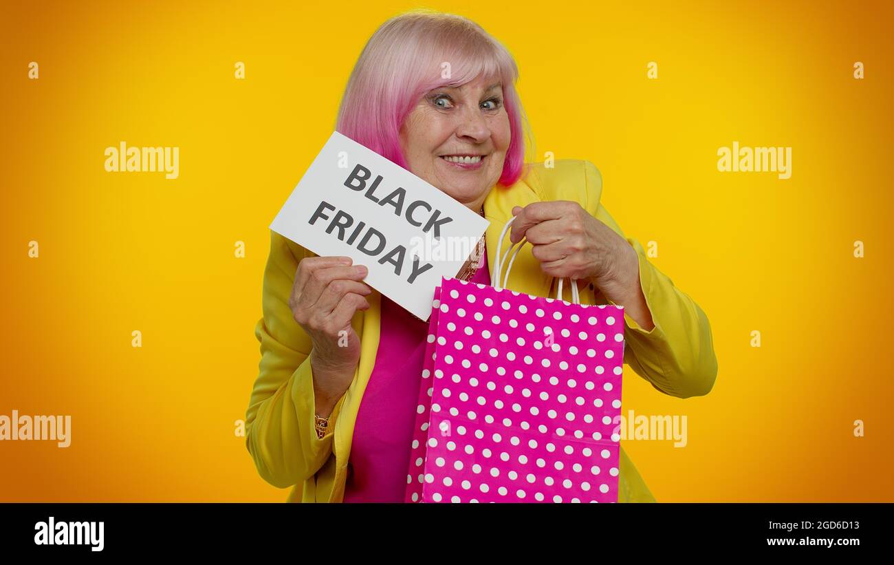 Elderly granny woman showing Black Friday inscription banner text ...