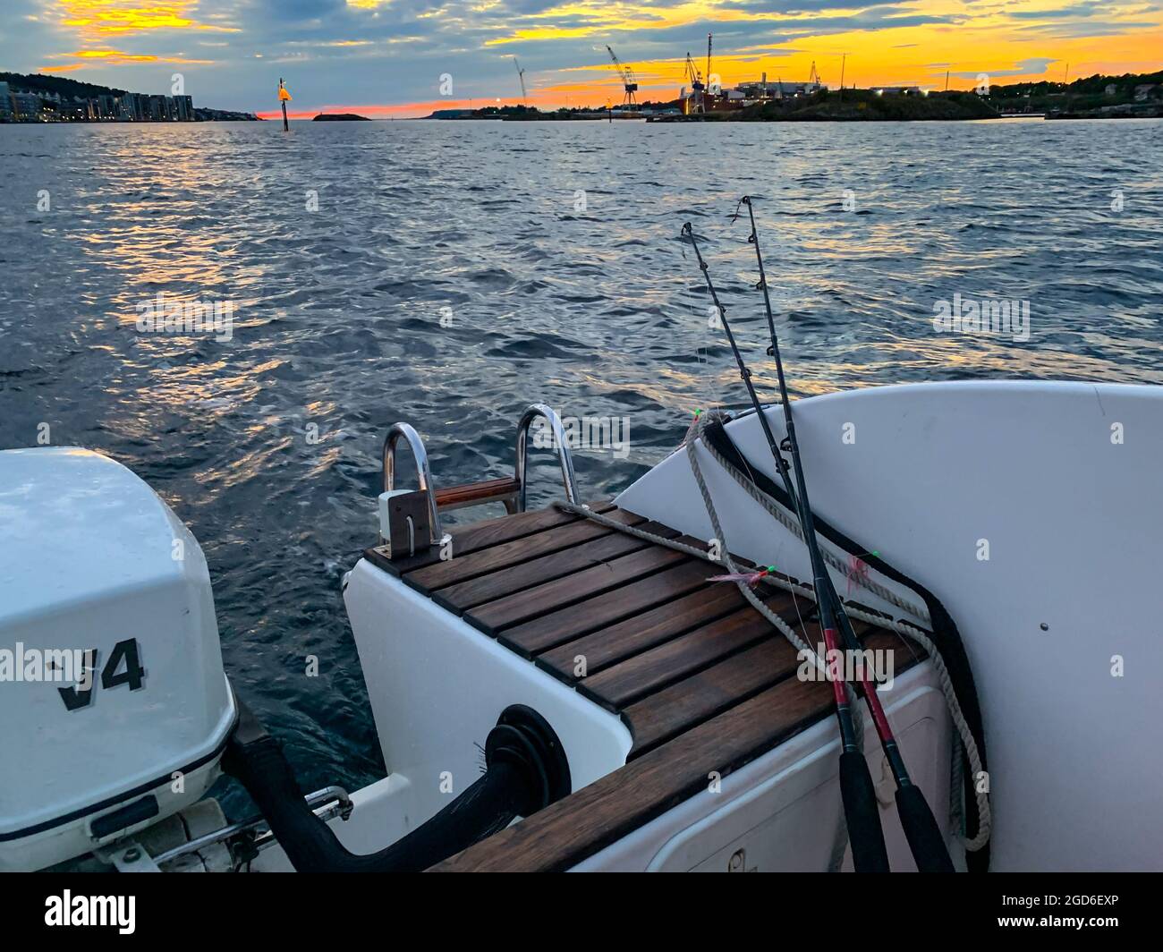 Fishing Polls On The Back of A Boat During Ocean Sunset. Vacation ...