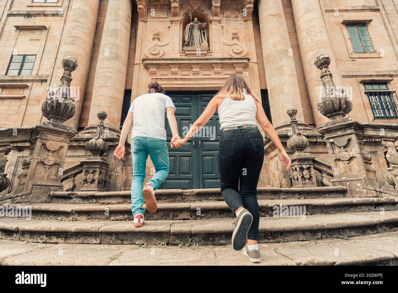 Man and woman going up steps hi-res stock photography and images - Alamy