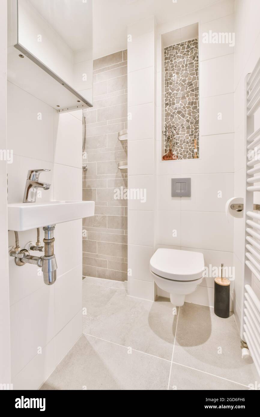 Interior of small clean washroom in miniature style Stock Photo - Alamy