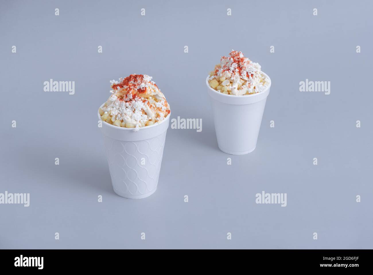 Mexican snack, two trolley, prepared esquite, corn in a cup, with chili ...