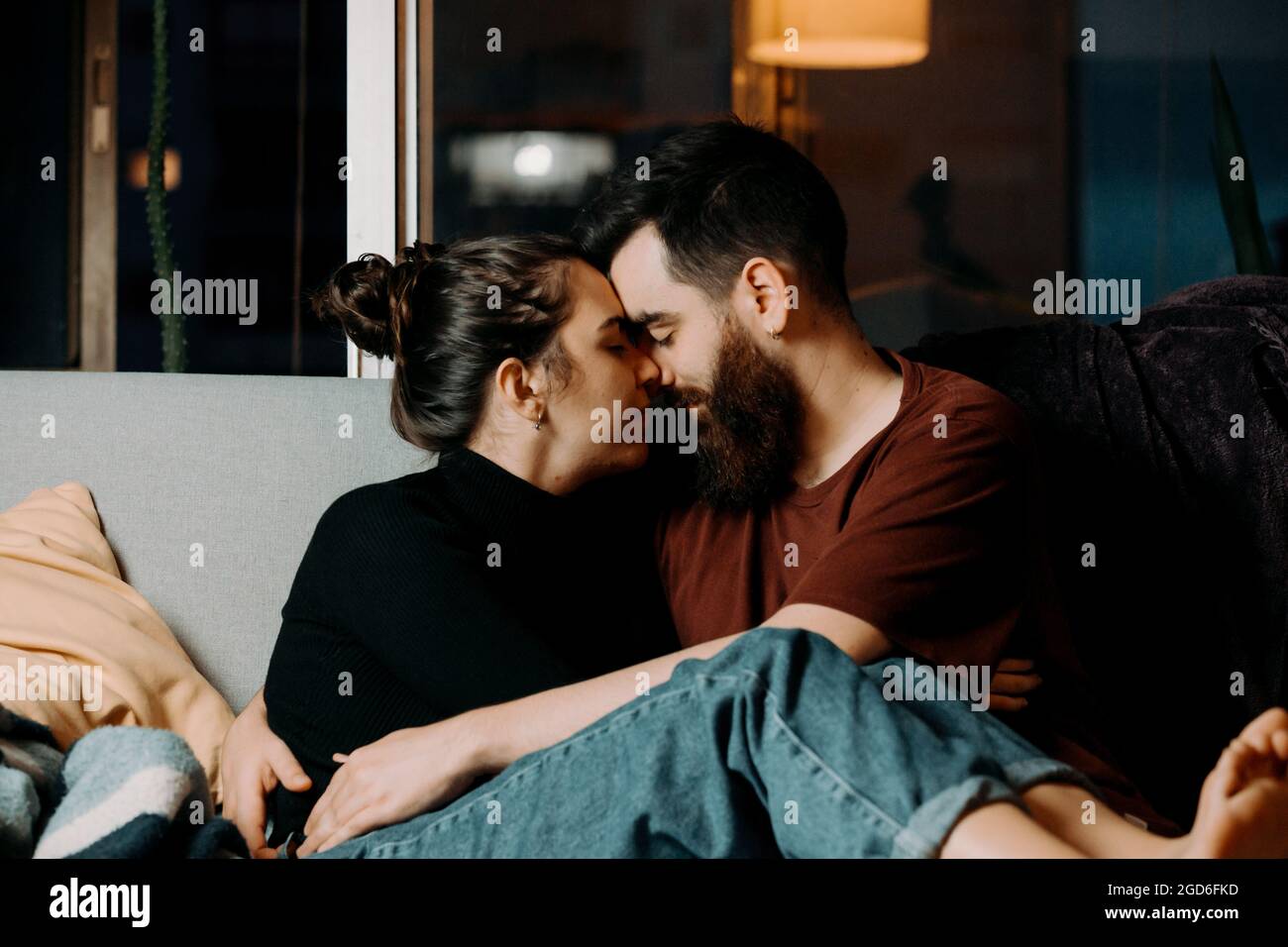 Man cuddling with two woman hi-res stock photography and images - Alamy